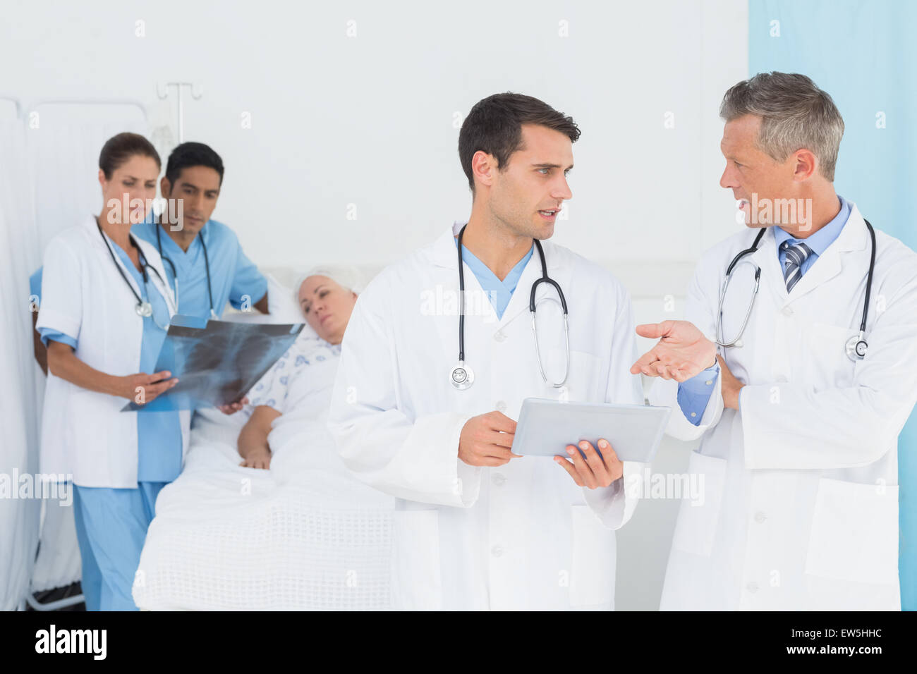 Report reading with patient behind Stock Photo - Alamy