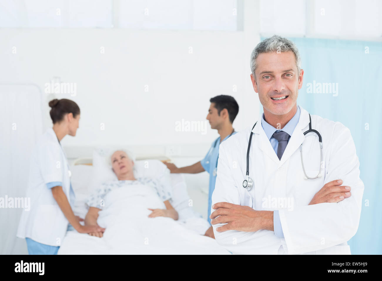 Doctor stethoscope hands crossed behind hi-res stock photography and ...