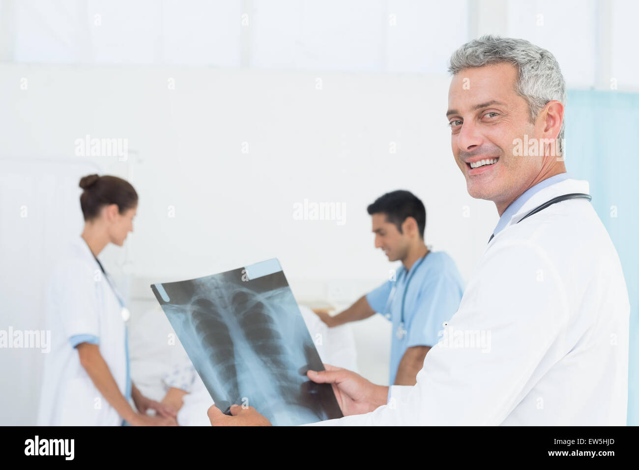 Male and female doctors examining x-ray Stock Photo - Alamy