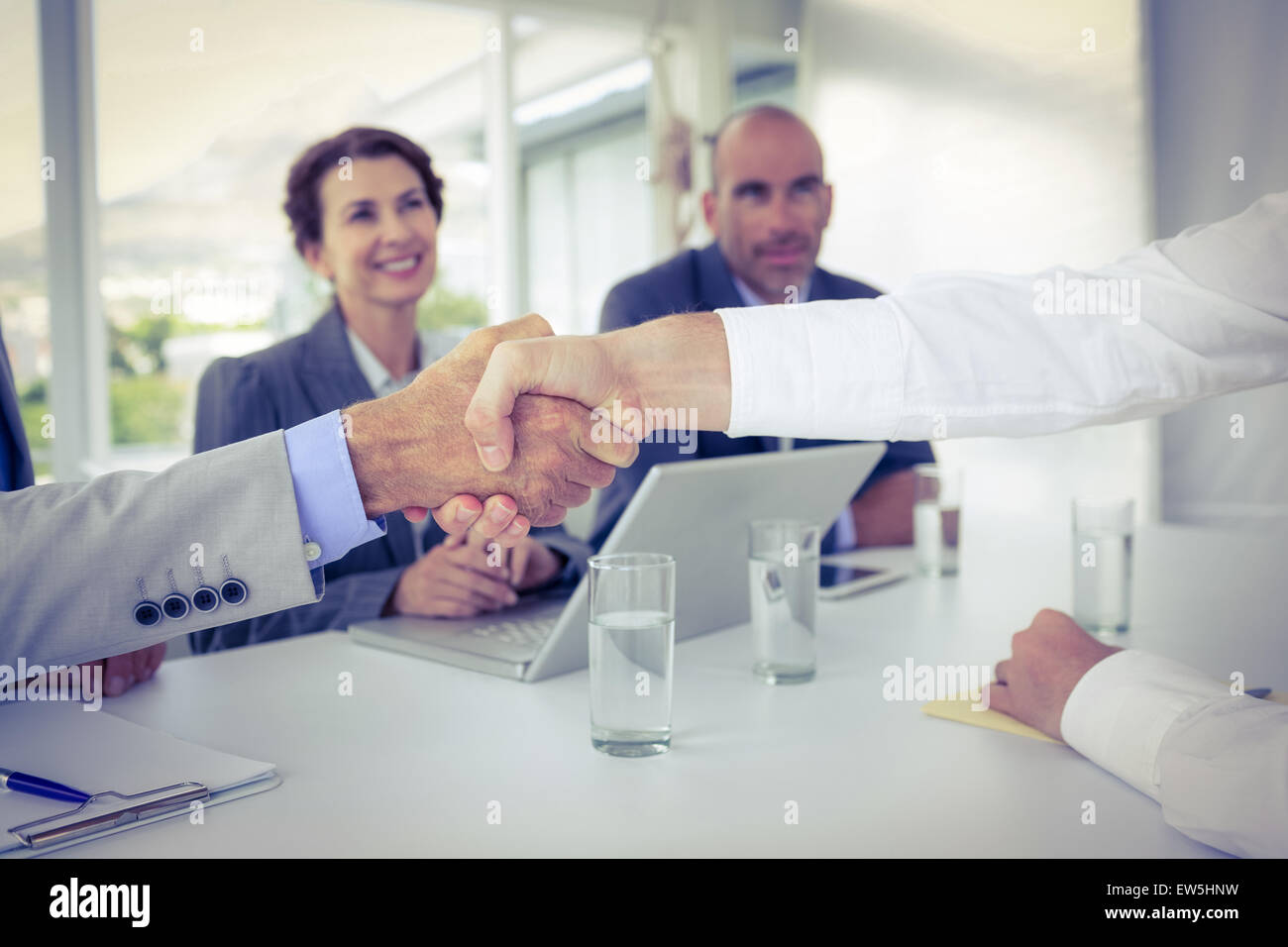 Business people shaking hands at interview Stock Photo - Alamy