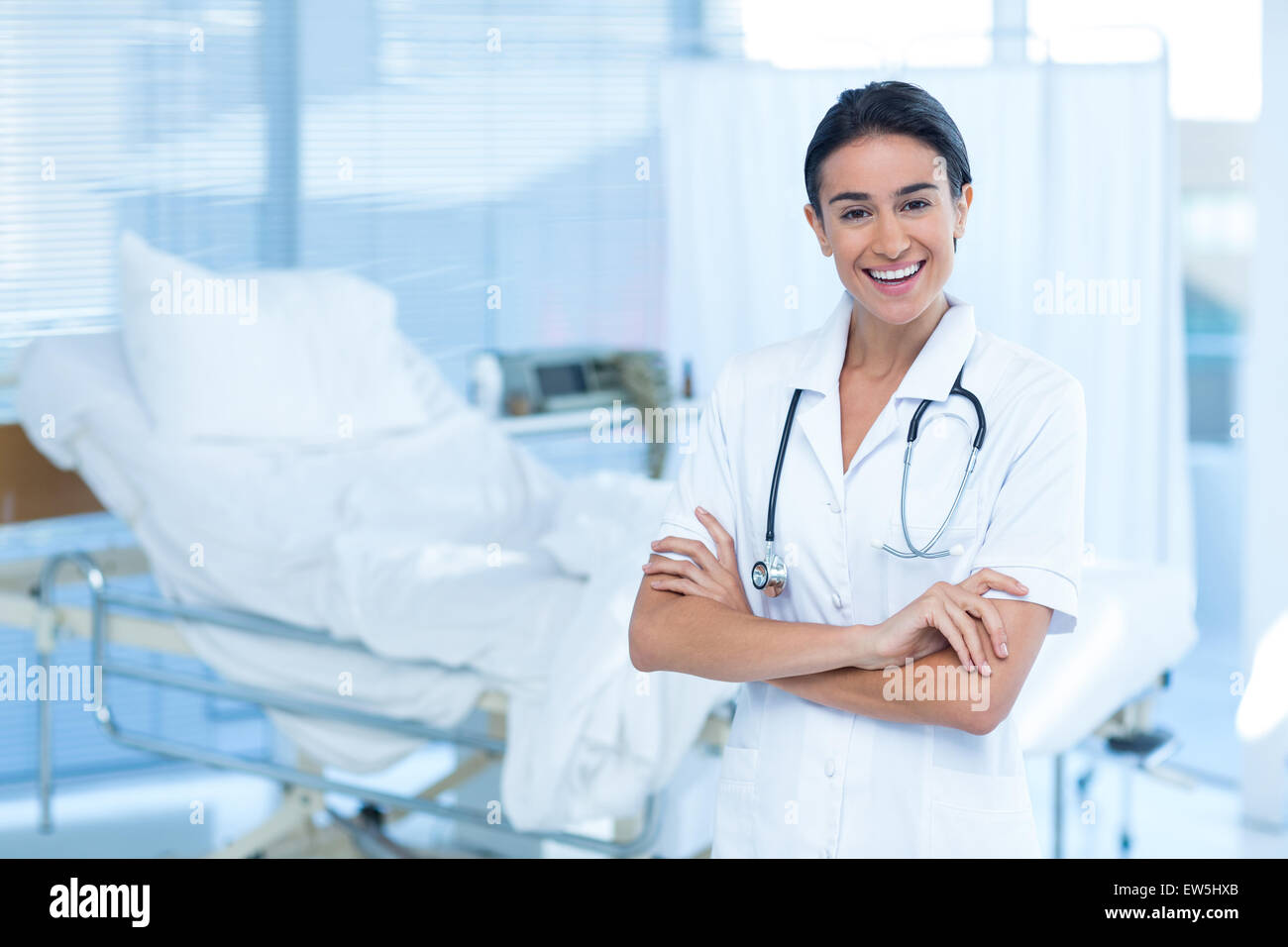 Beautiful smiling doctor smiling at camera Stock Photo - Alamy