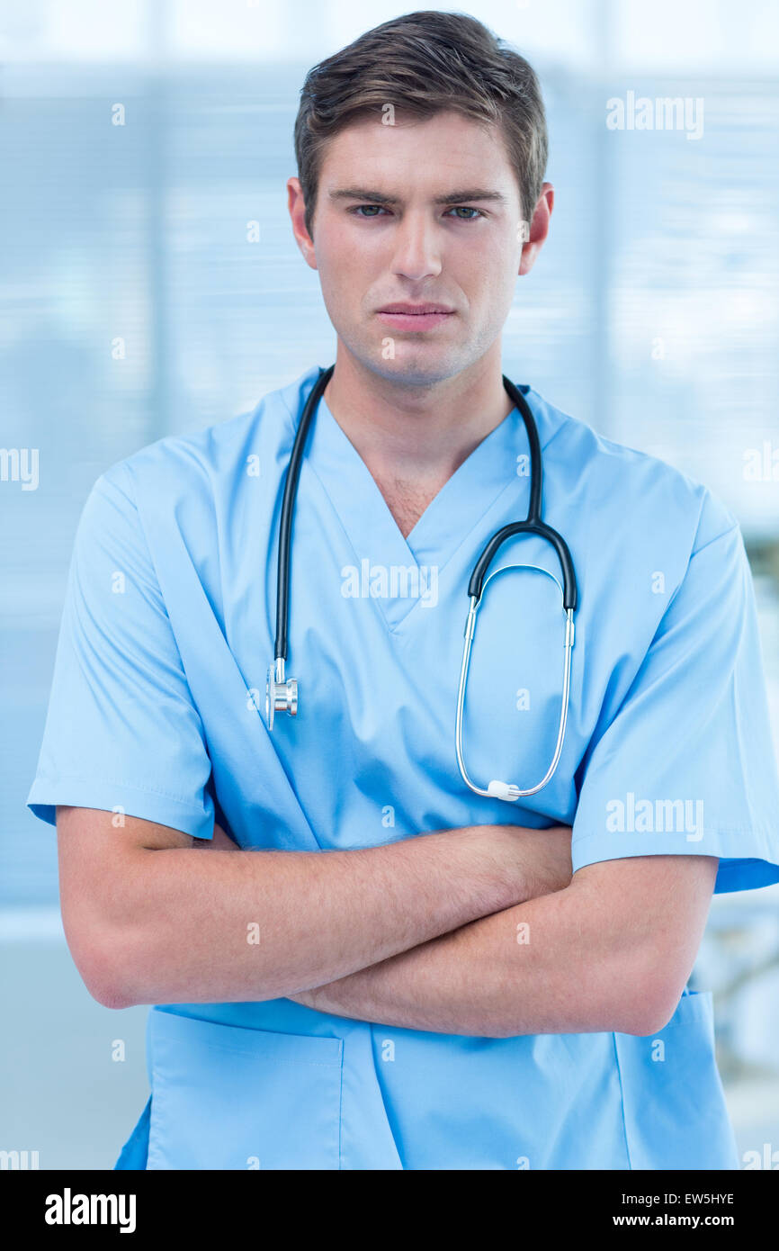Unsmiling doctor looking at camera Stock Photo - Alamy