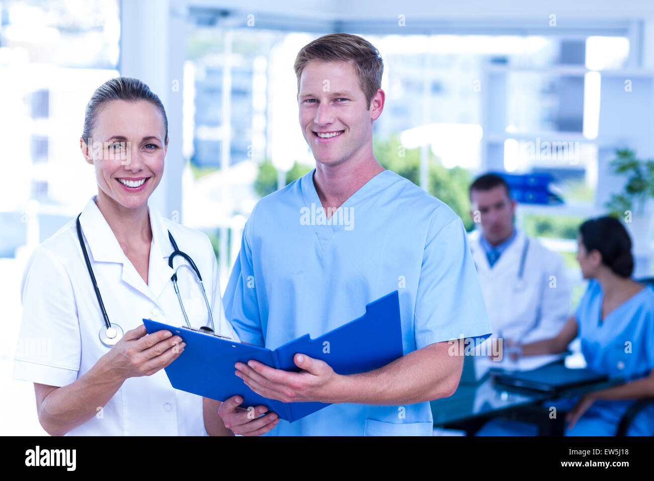 Doctors smiling at the camera Stock Photo - Alamy