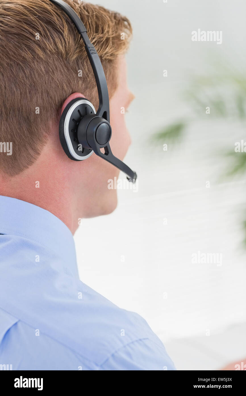 Handsome agent with headset Stock Photo - Alamy