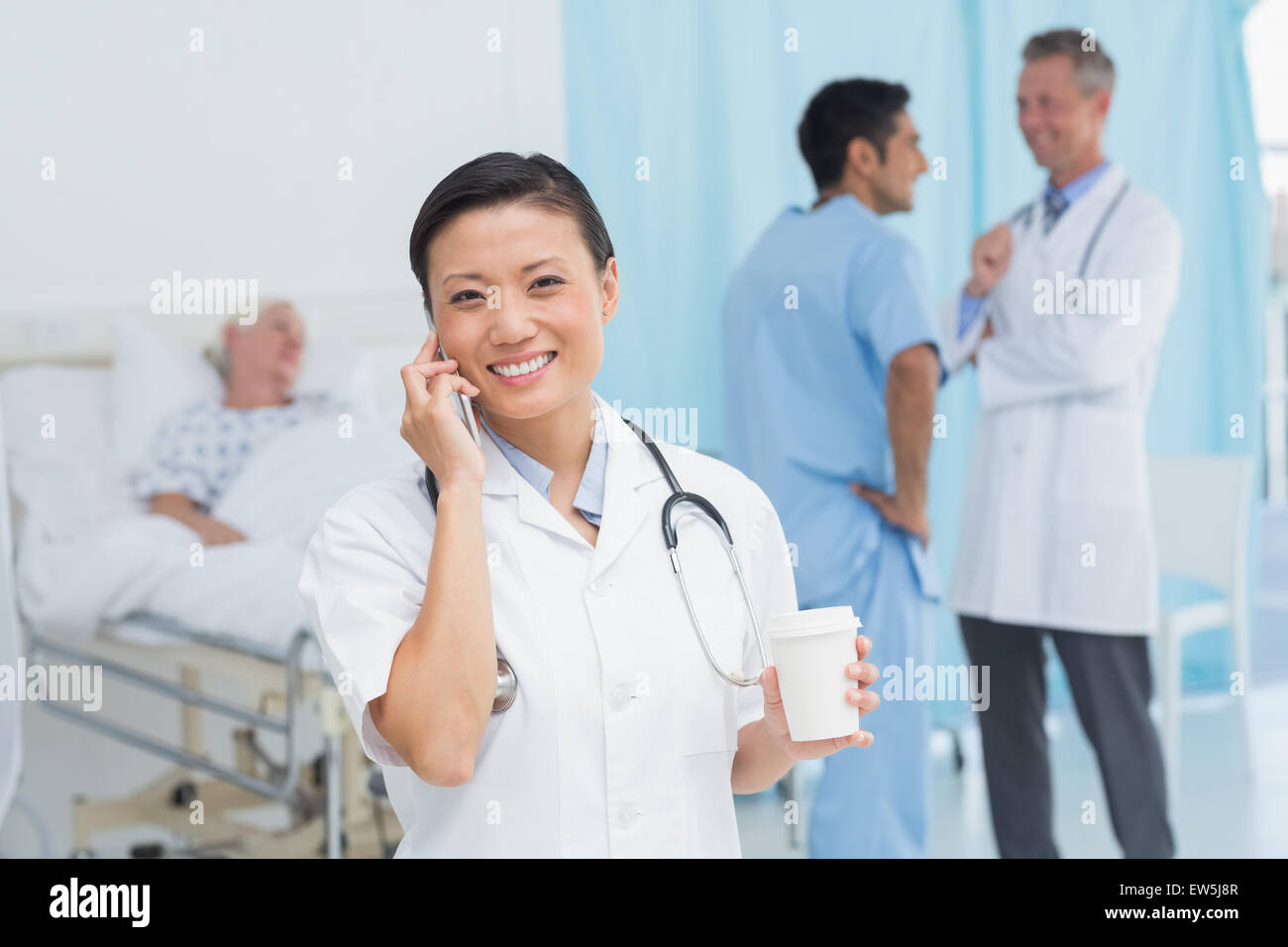 Doctor on phone Stock Photo - Alamy