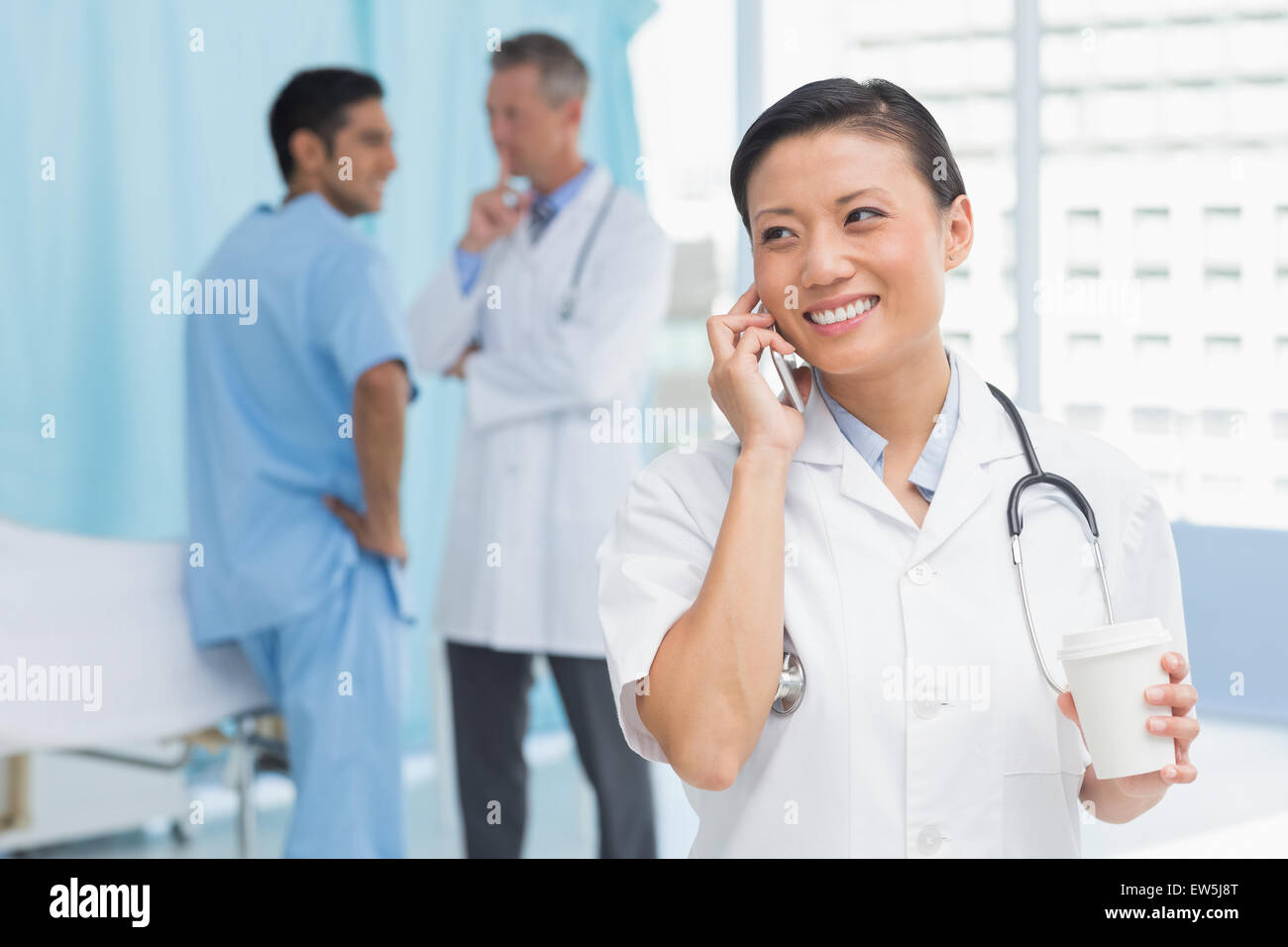 Doctor on phone Stock Photo - Alamy