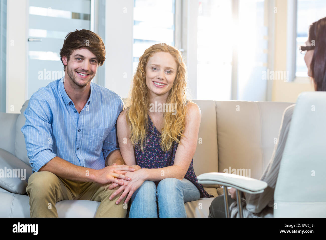 Psychologist and happy couple Stock Photo - Alamy