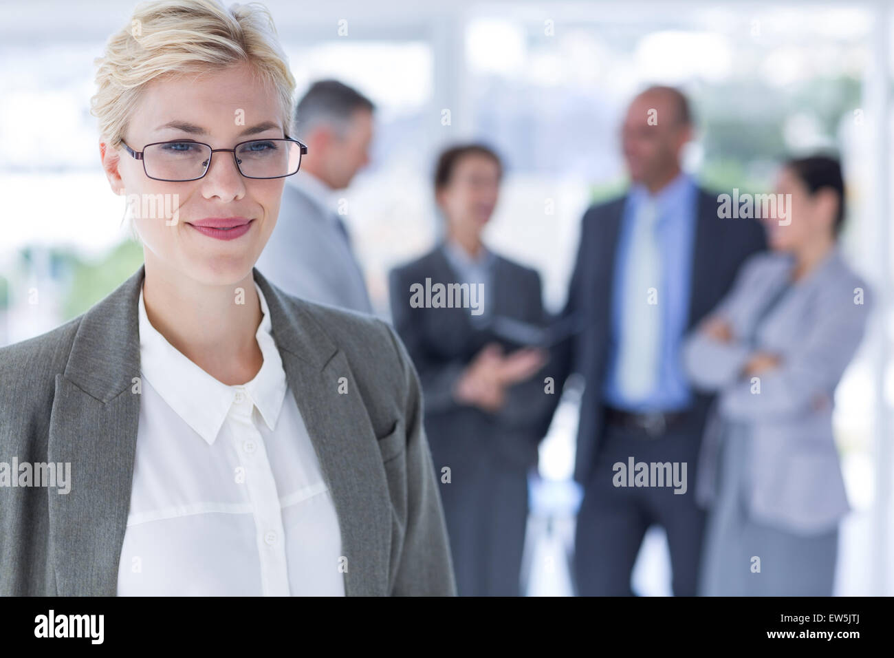 smiling businesswoman looking at the camera Stock Photo - Alamy