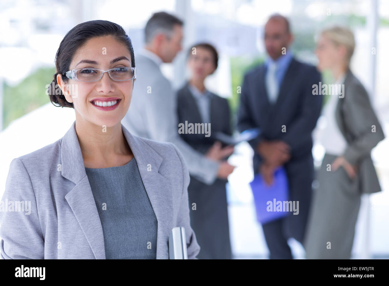 smiling businesswoman looking at the camera Stock Photo - Alamy