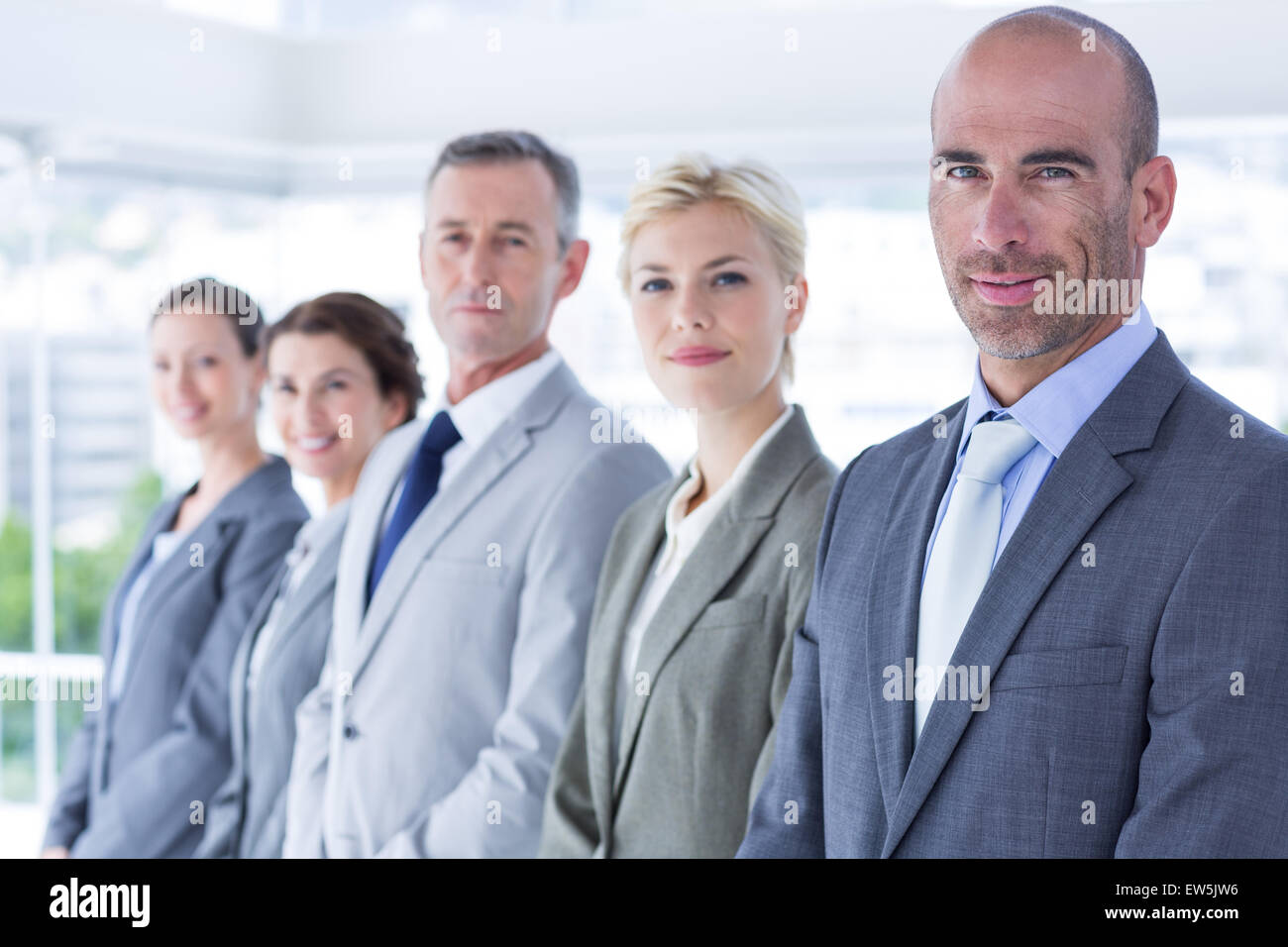 Business people looking at camera Stock Photo - Alamy