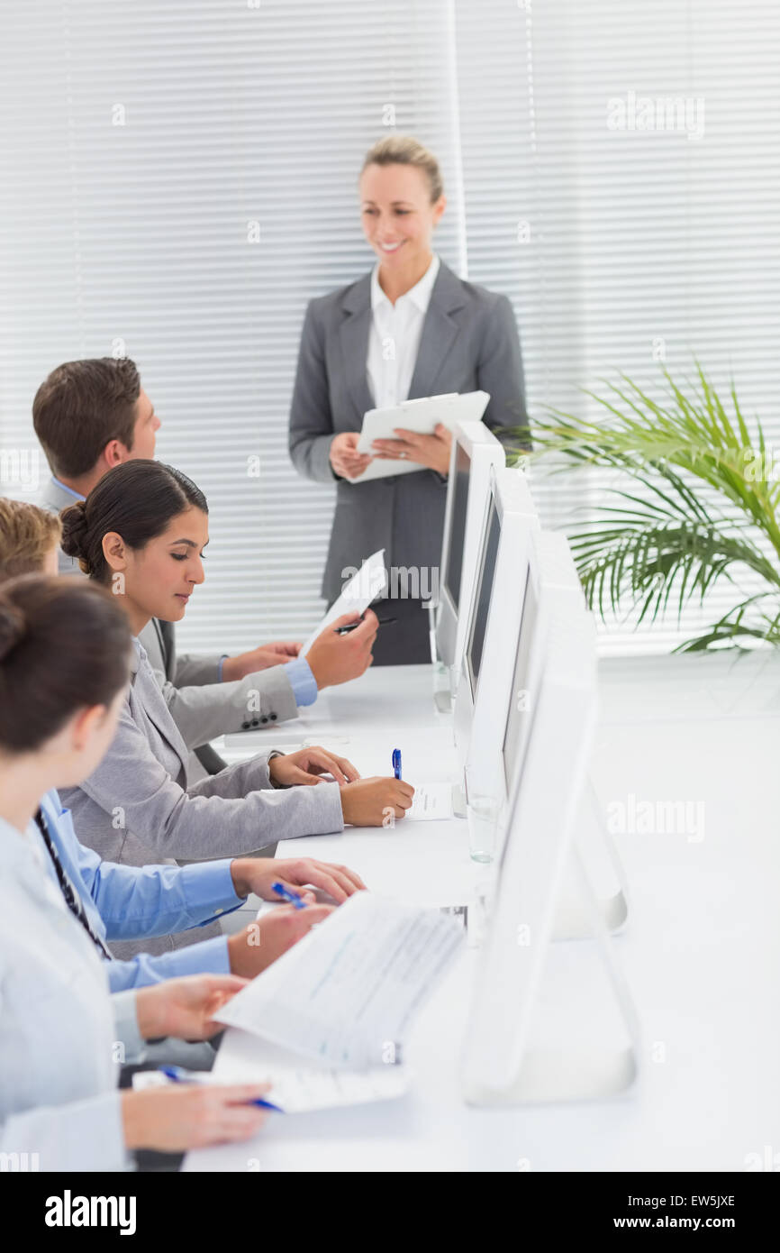 Business team writing brainstorming ideas in their notepad Stock Photo ...
