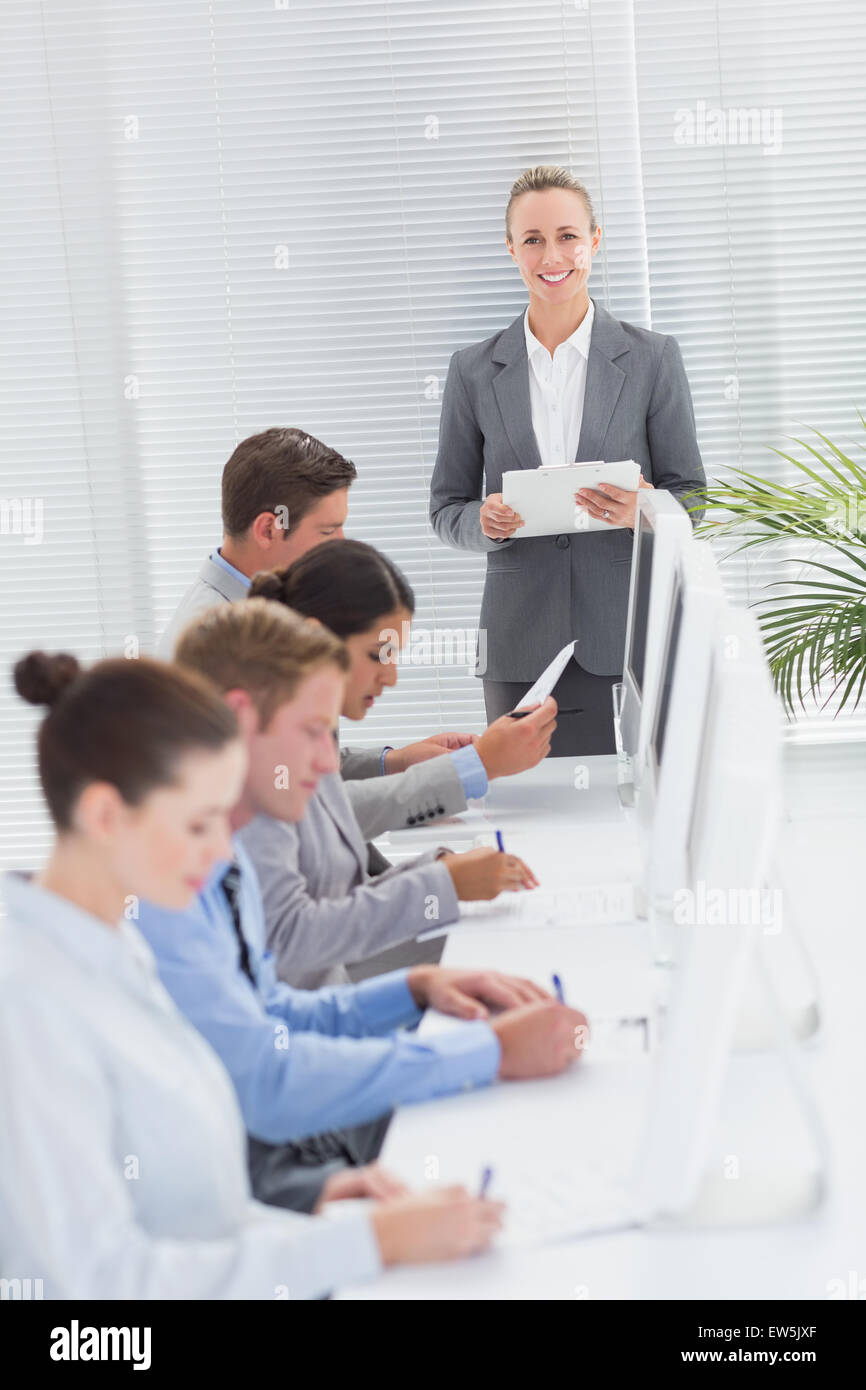 Business team writing brainstorming ideas in their notepad Stock Photo ...