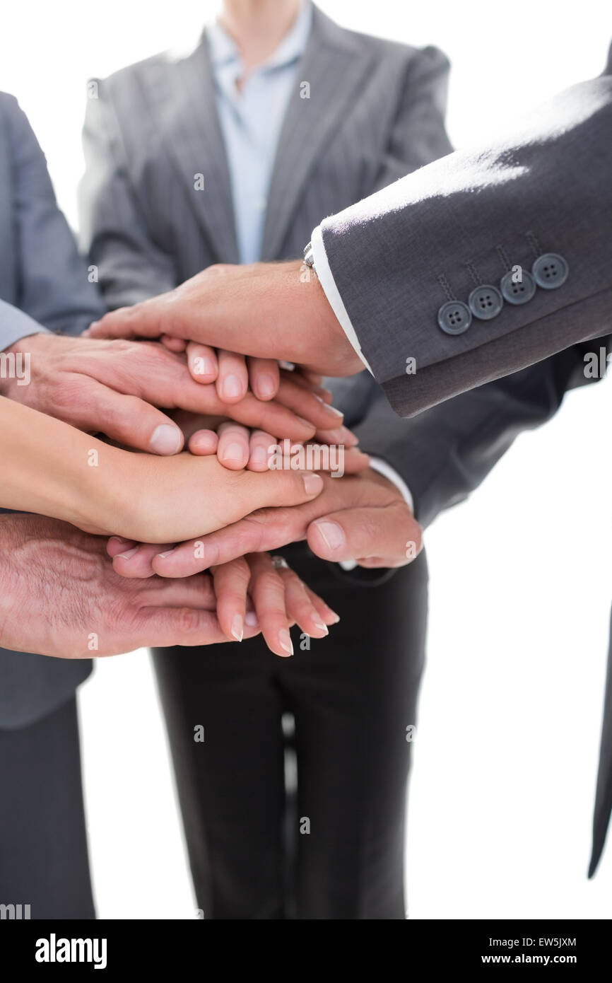 Business team standing hands together Stock Photo - Alamy