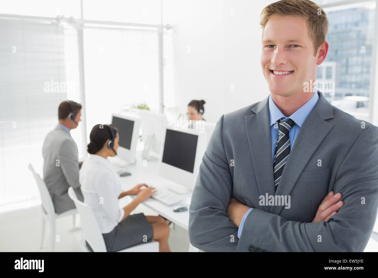 Male standing behind sitting female hi-res stock photography and images ...