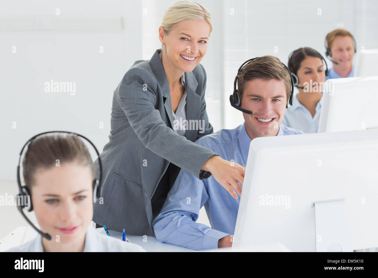 Male manager helping business team hi-res stock photography and images ...