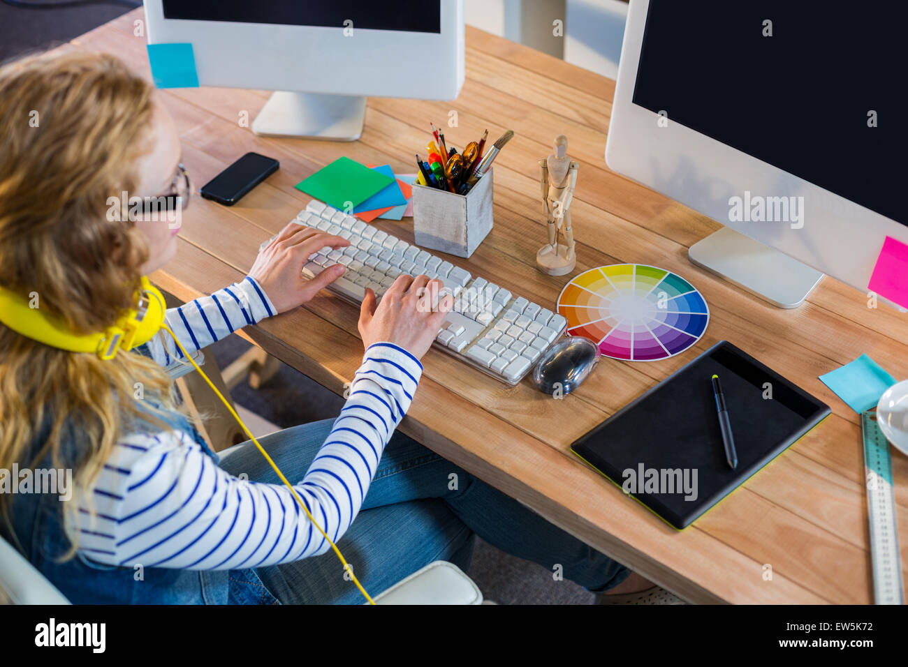 Designer typing on keyboard Stock Photo - Alamy