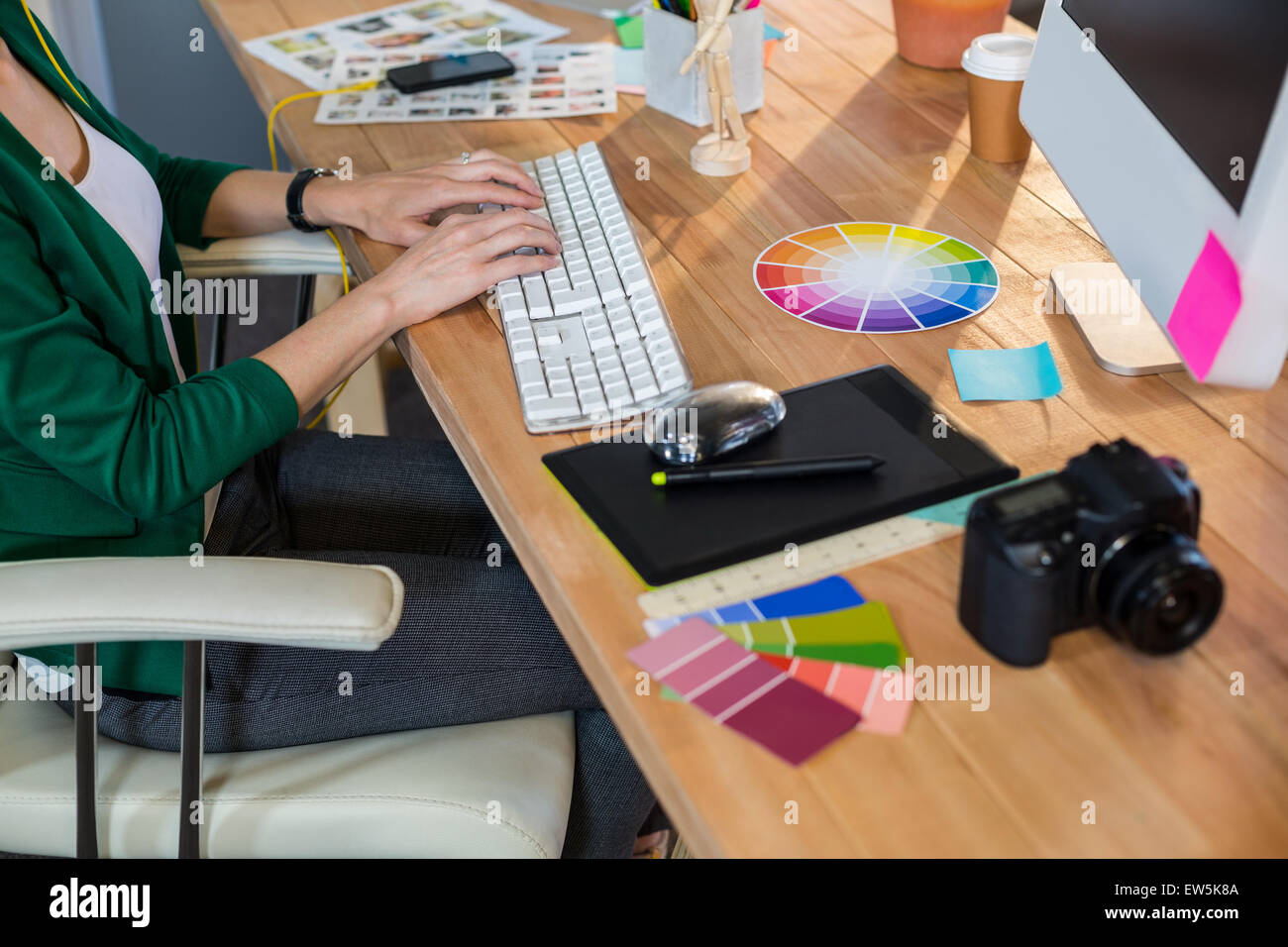 Designer typing on keyboard Stock Photo - Alamy