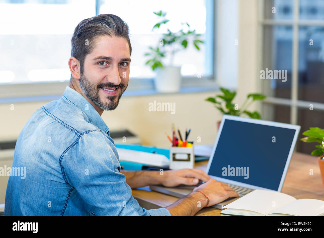 Smiling typing hi-res stock photography and images - Alamy
