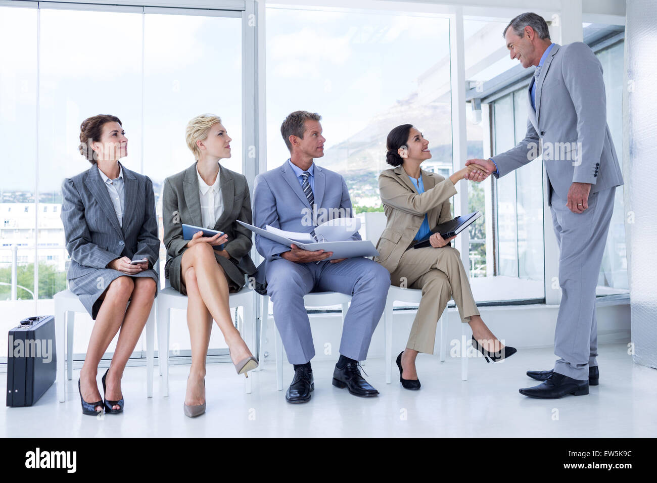 Business people waiting to be called into interview Stock Photo - Alamy