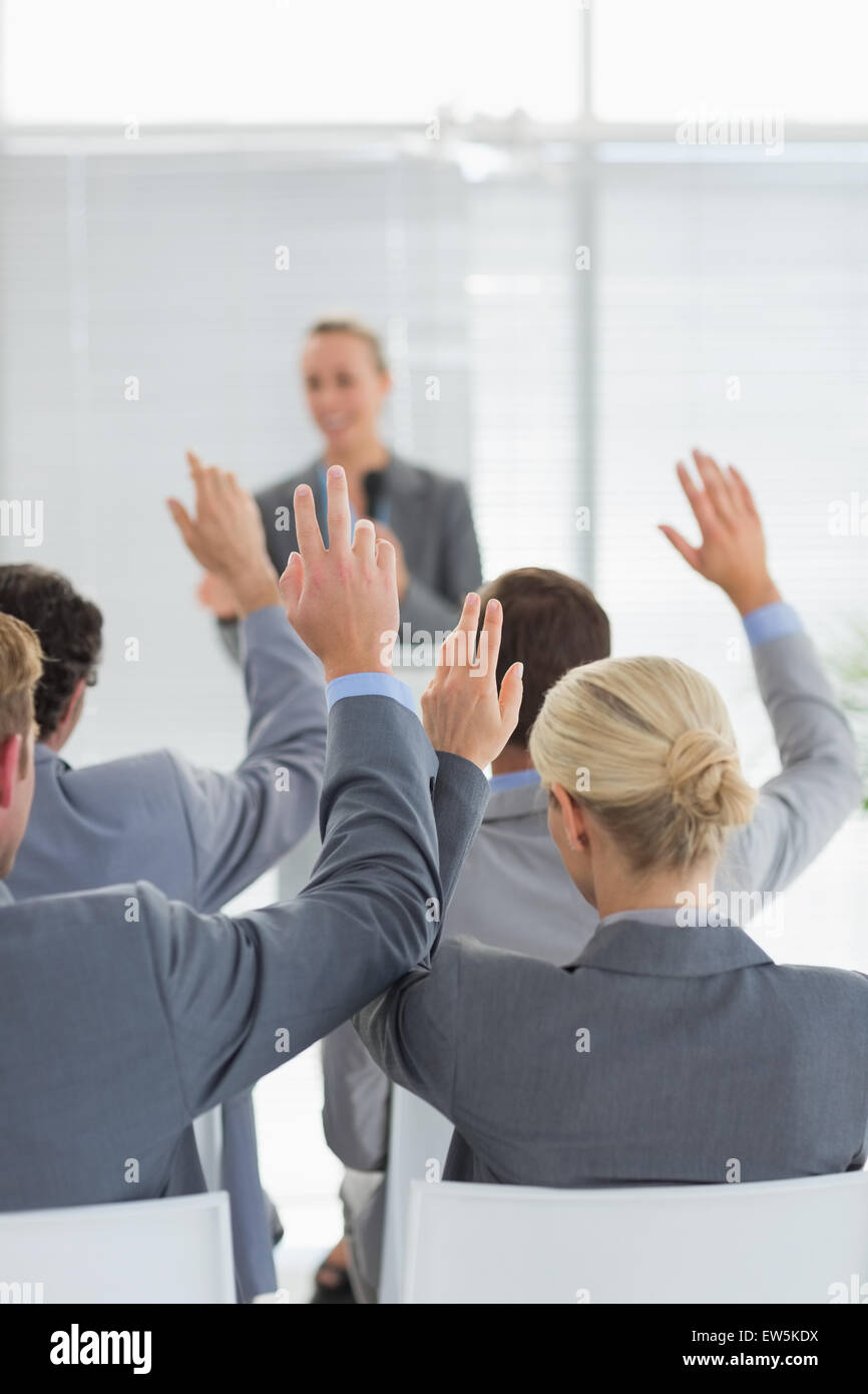 Business team raising hands during conference Stock Photo - Alamy