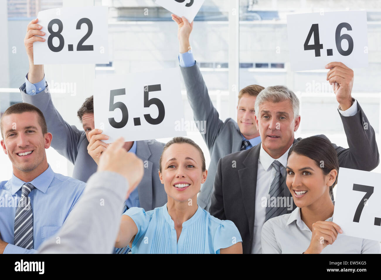 Business team giving mark after conference Stock Photo - Alamy