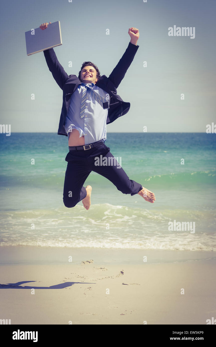 Man suit jumping laptop hi-res stock photography and images - Alamy