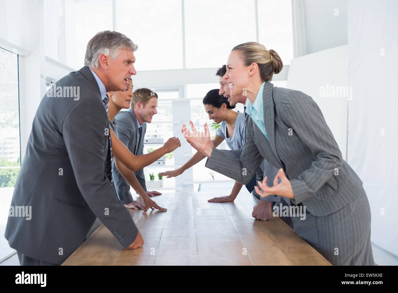 Irritated business team arguing Stock Photo - Alamy