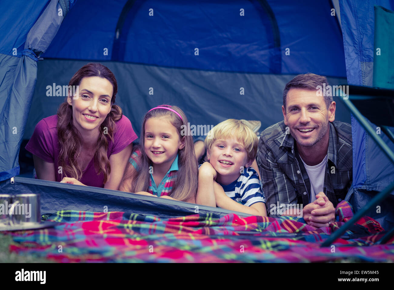Happy family camping in the park Stock Photo - Alamy