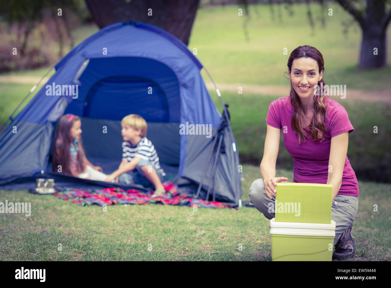Mother and children camping in the park Stock Photo - Alamy