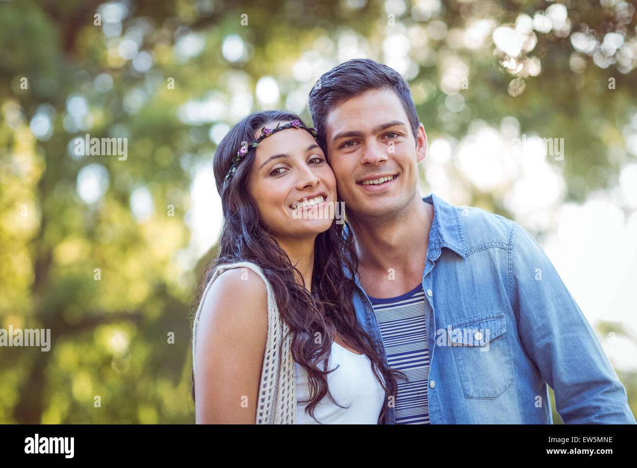 Cute couple smiling in the park Stock Photo - Alamy