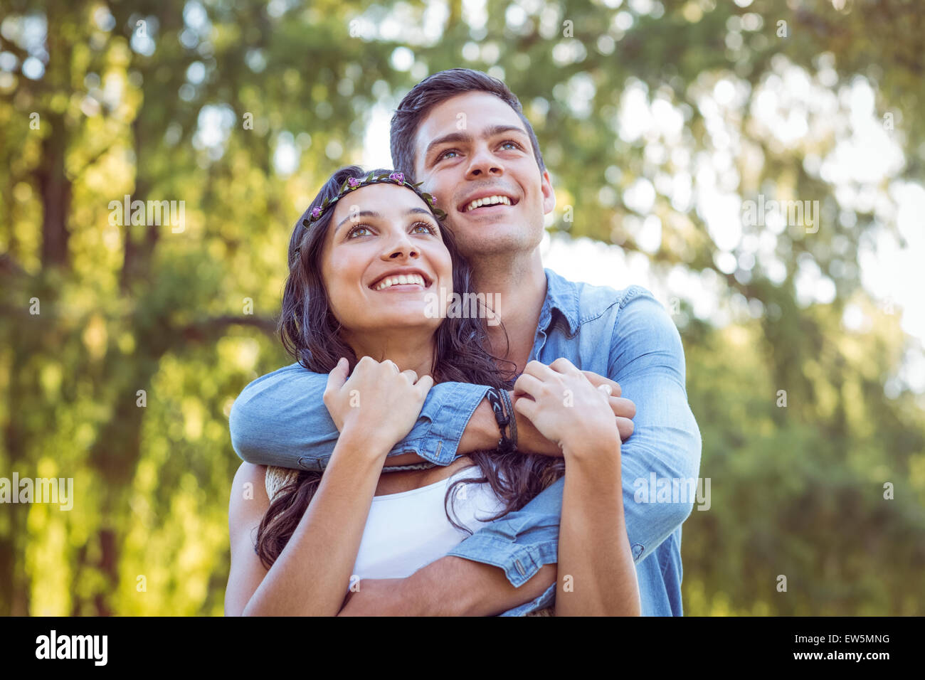 Cute couple smiling in the park Stock Photo - Alamy