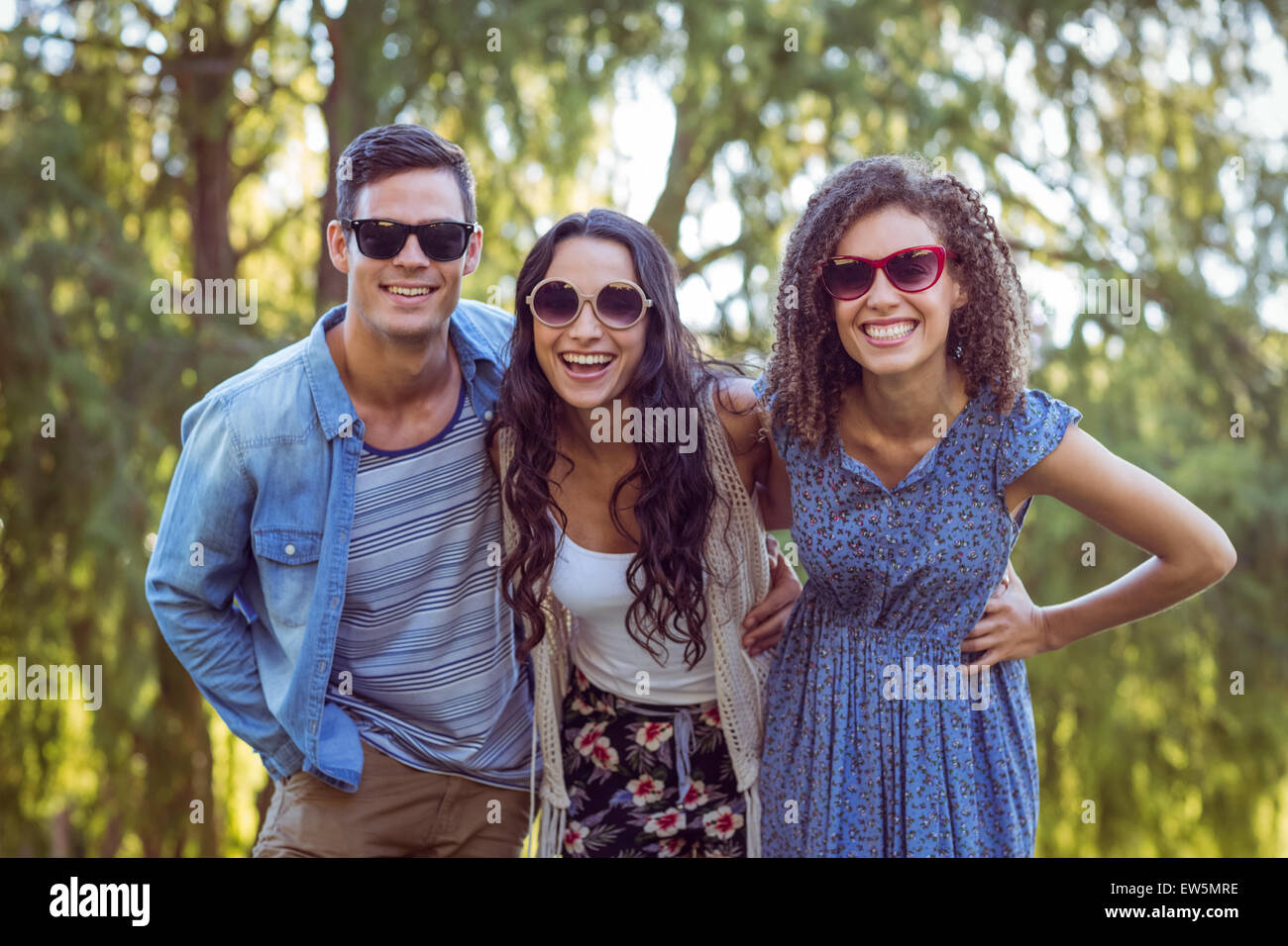 Happy friends in the park Stock Photo - Alamy