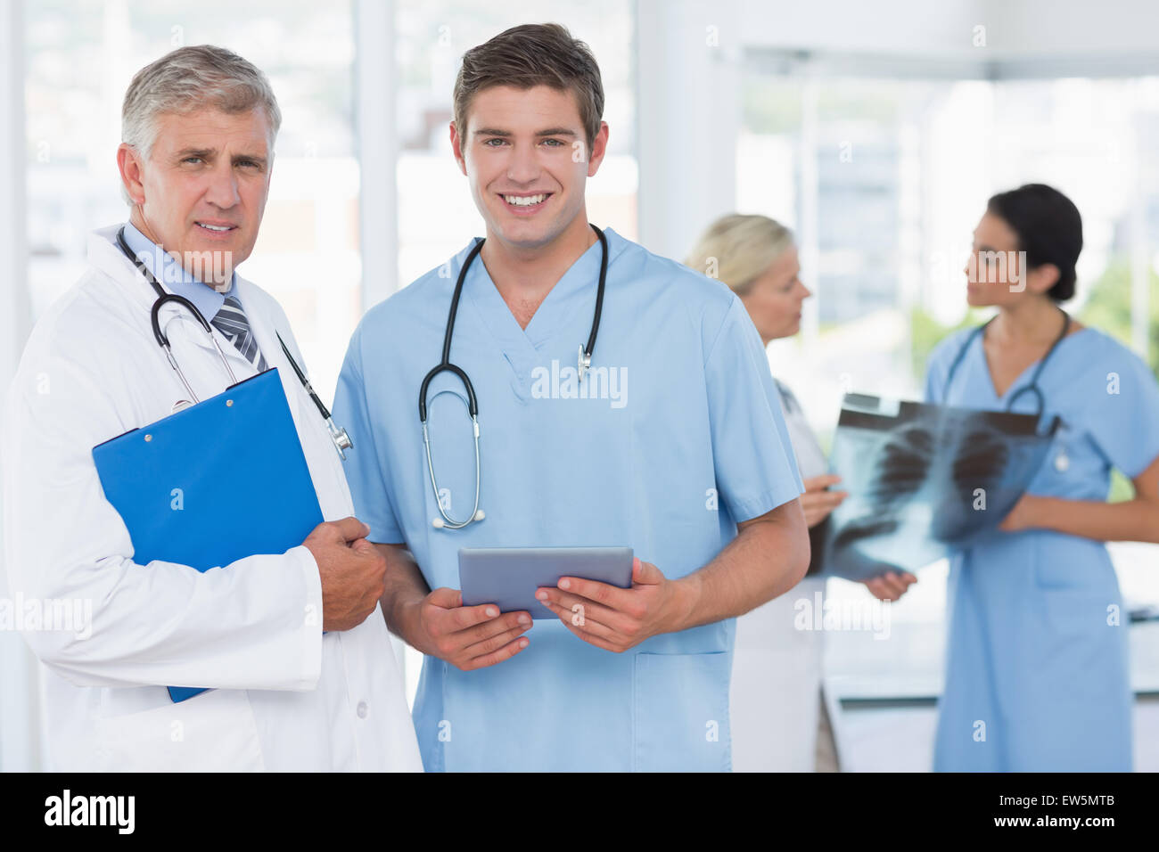 Smiling doctors discussing hi-res stock photography and images - Alamy