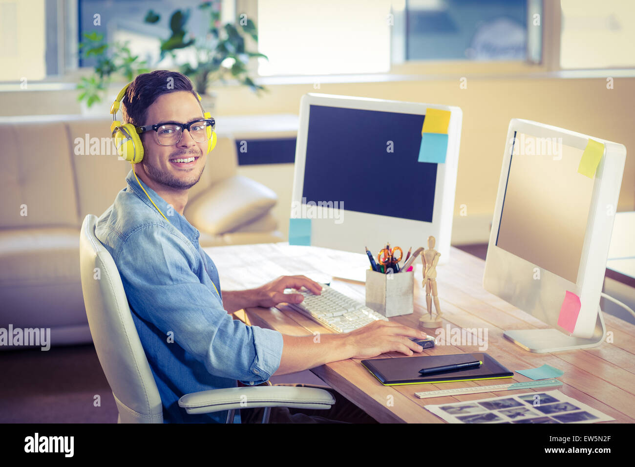 Happy designer smiling at camera Stock Photo - Alamy