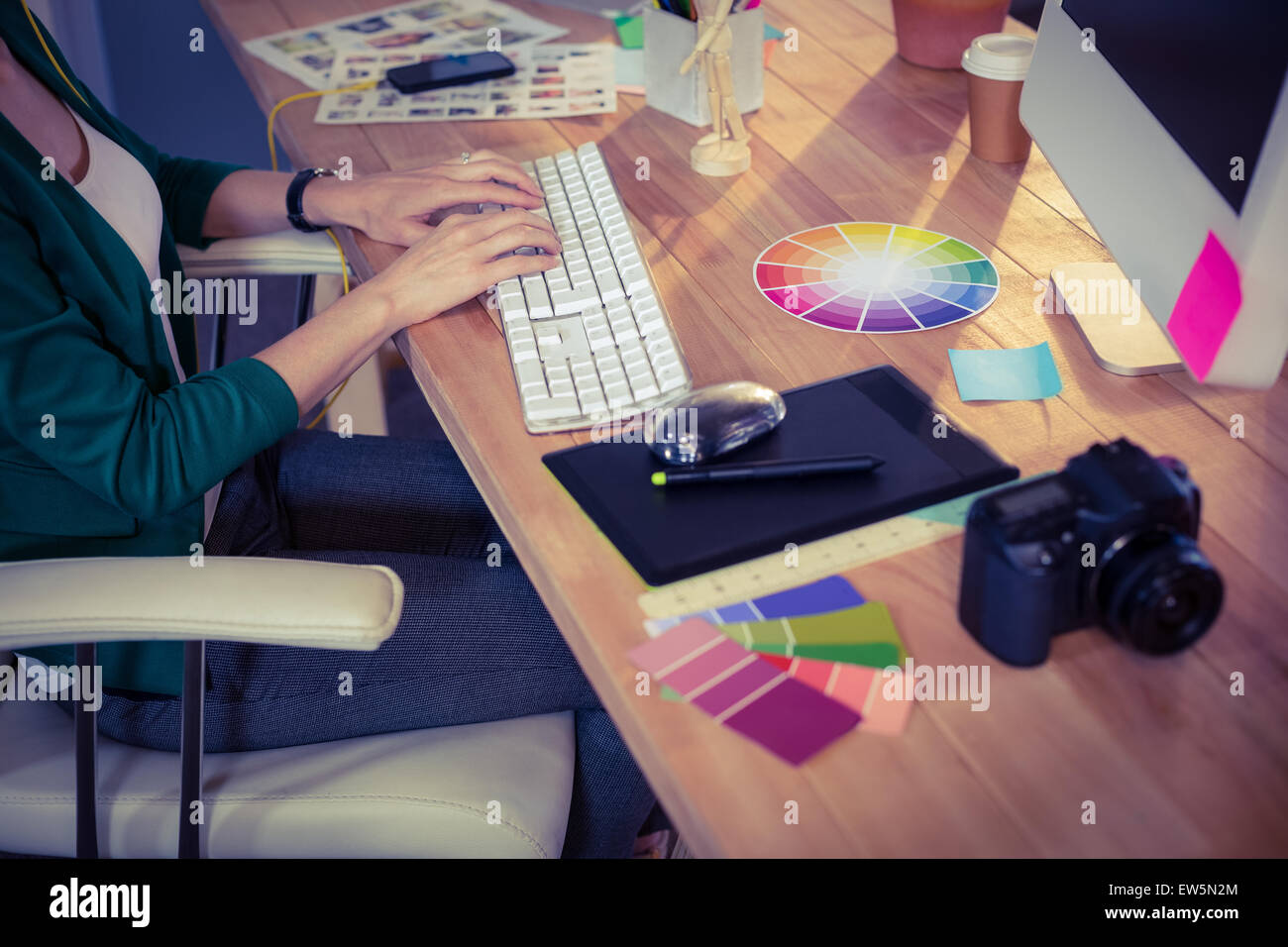 Designer working at her desk Stock Photo - Alamy