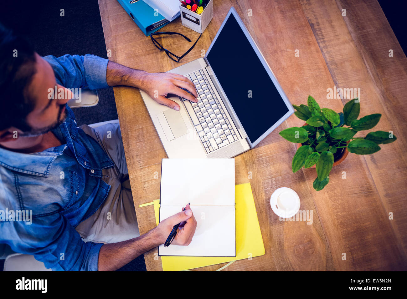 Designer working at his desk Stock Photo - Alamy