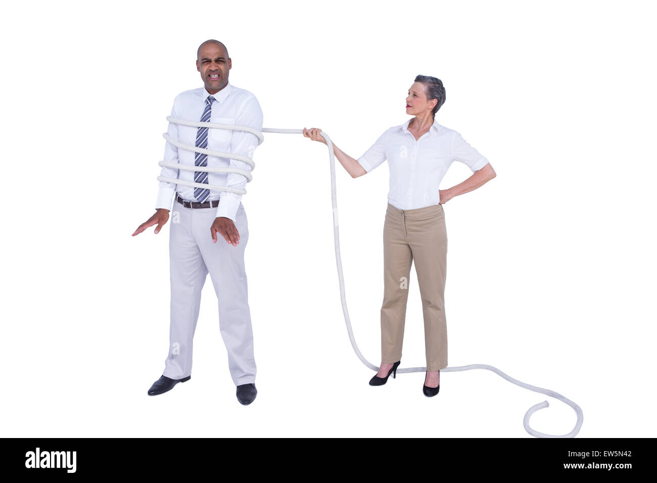 Businesswoman tying up businessman Stock Photo - Alamy