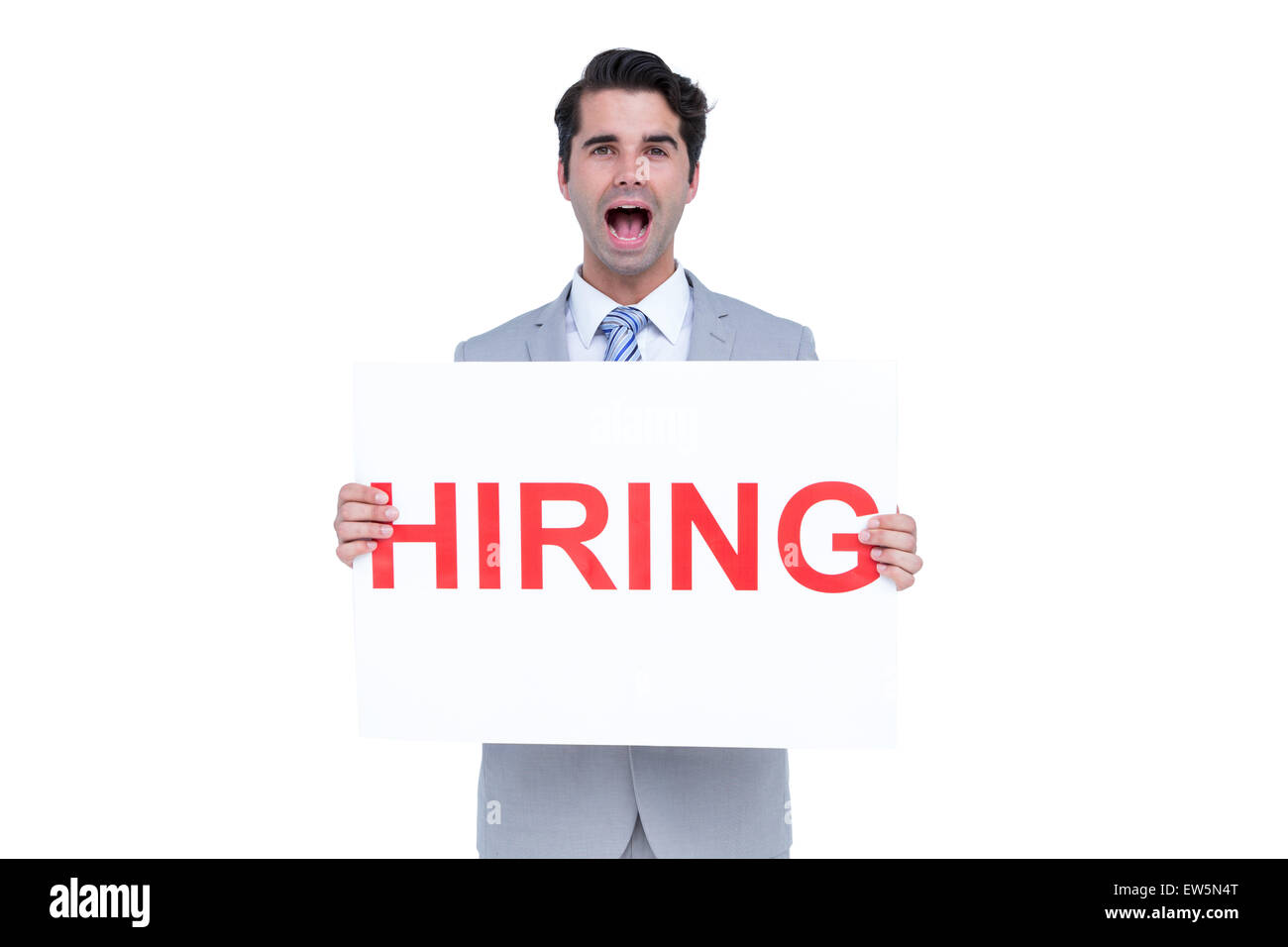 Happy businessman holding a hiring sign Stock Photo - Alamy