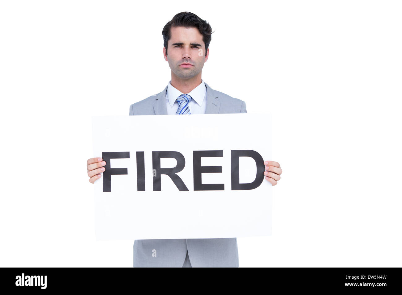 Sad businessman holding a fired sign Stock Photo - Alamy