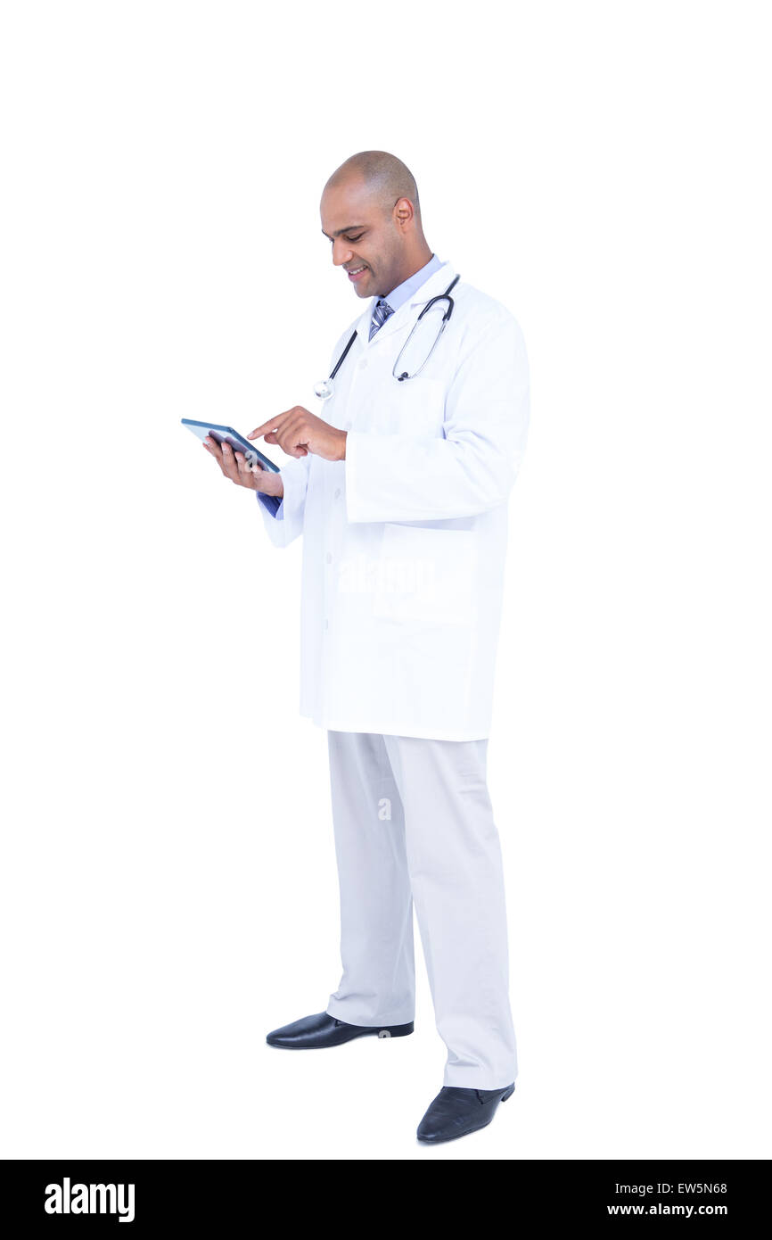 Smiling doctor using tablet Stock Photo - Alamy
