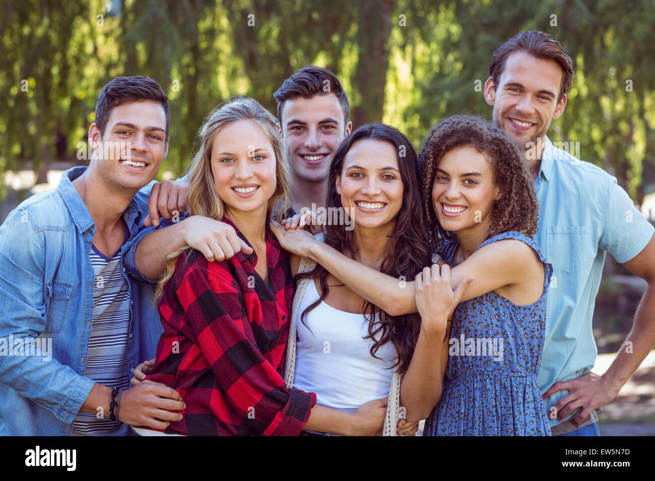 Happy friends in the park Stock Photo - Alamy