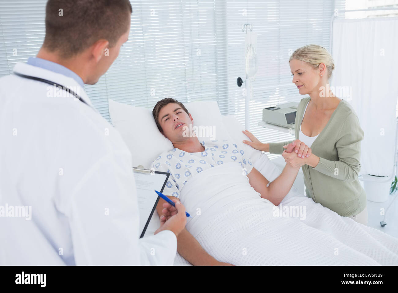 Doctor checking his patient Stock Photo - Alamy