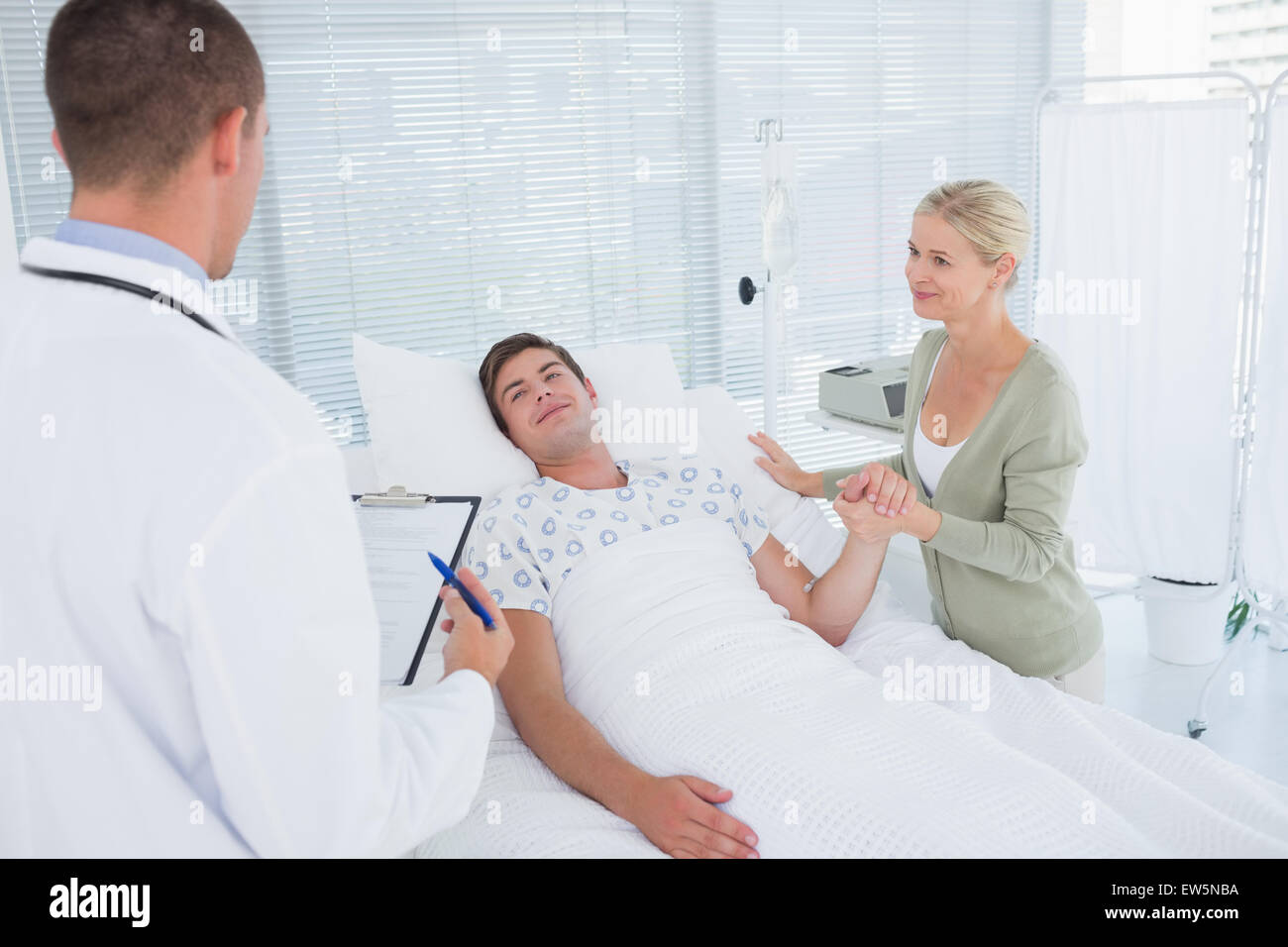 Doctor checking his patient Stock Photo - Alamy