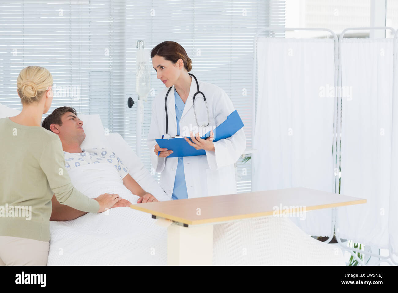 Doctor checking her patient Stock Photo - Alamy
