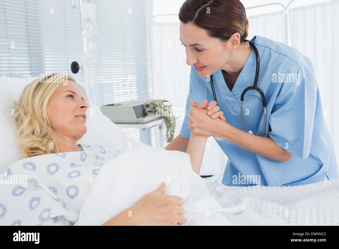 Doctor taking care of patient Stock Photo - Alamy
