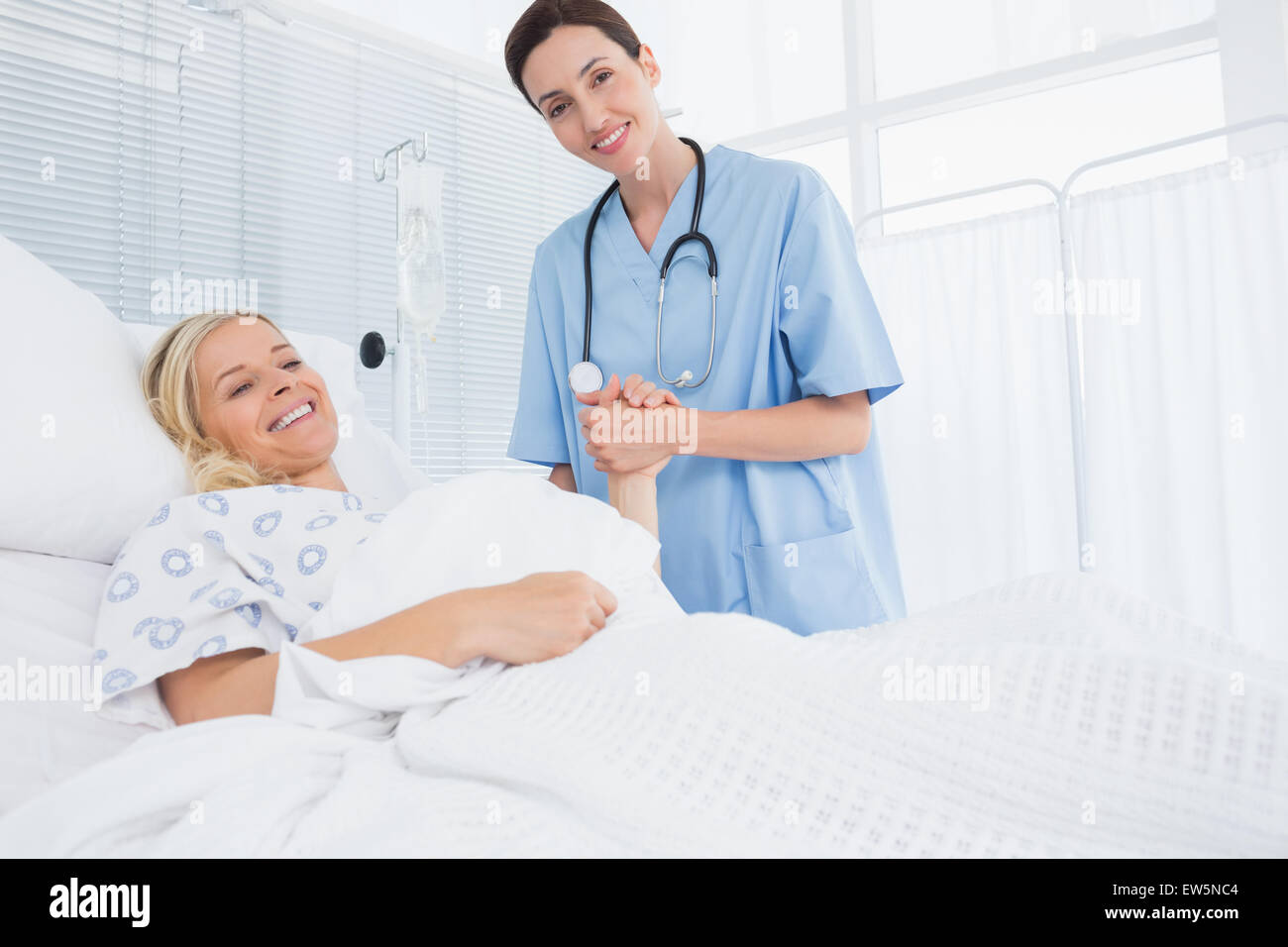 Doctor taking care of patient Stock Photo - Alamy