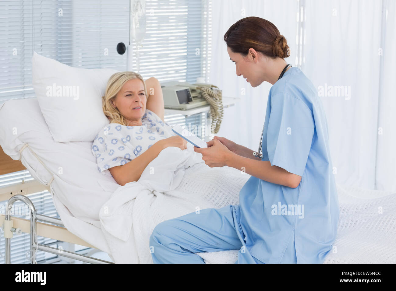 Doctor taking care of patient Stock Photo - Alamy