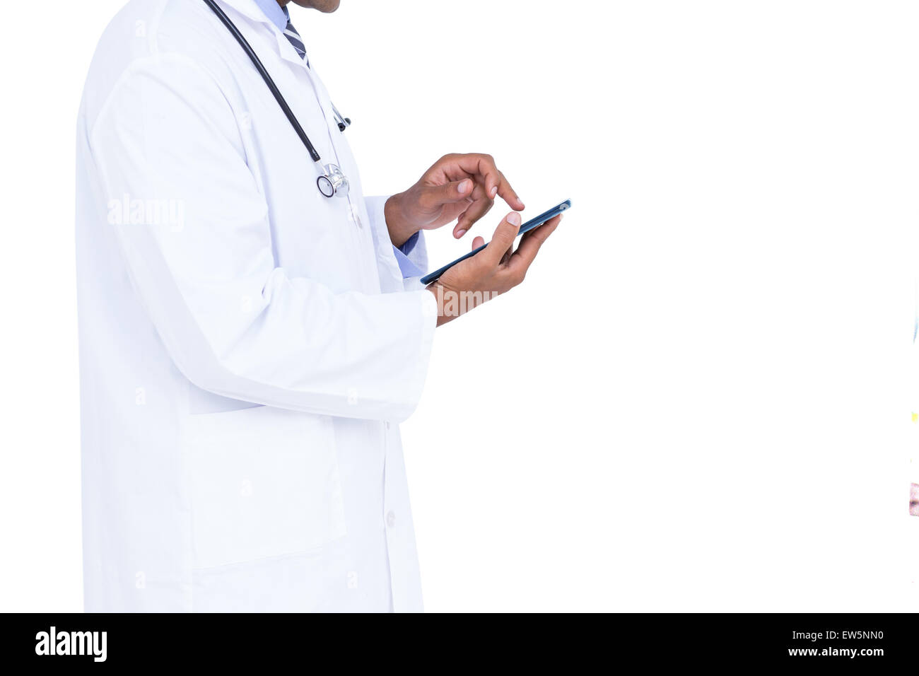 Standing doctor using tablet Stock Photo - Alamy