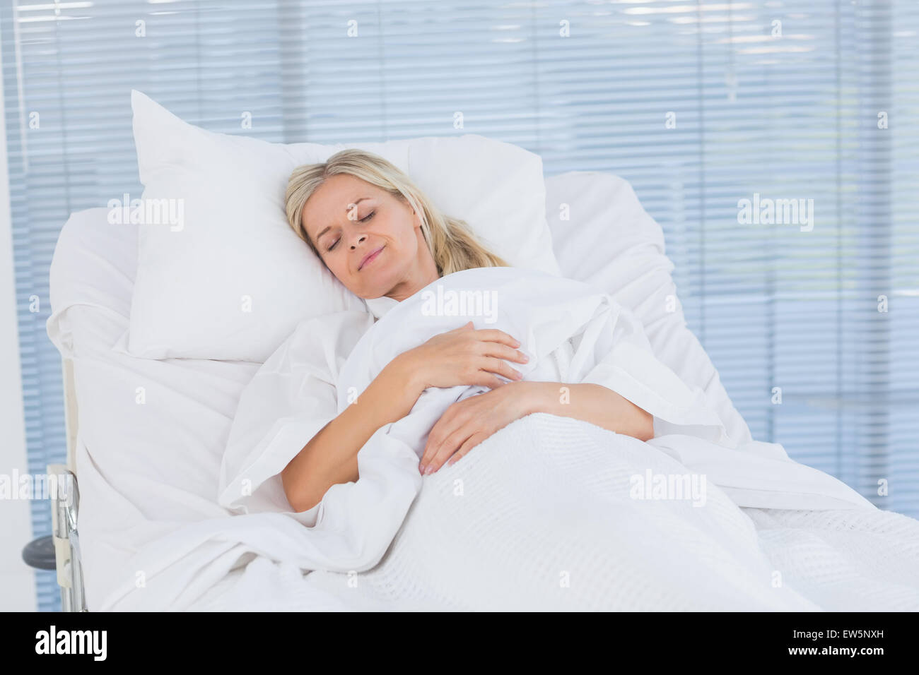 Happy patient lying on her bed Stock Photo - Alamy