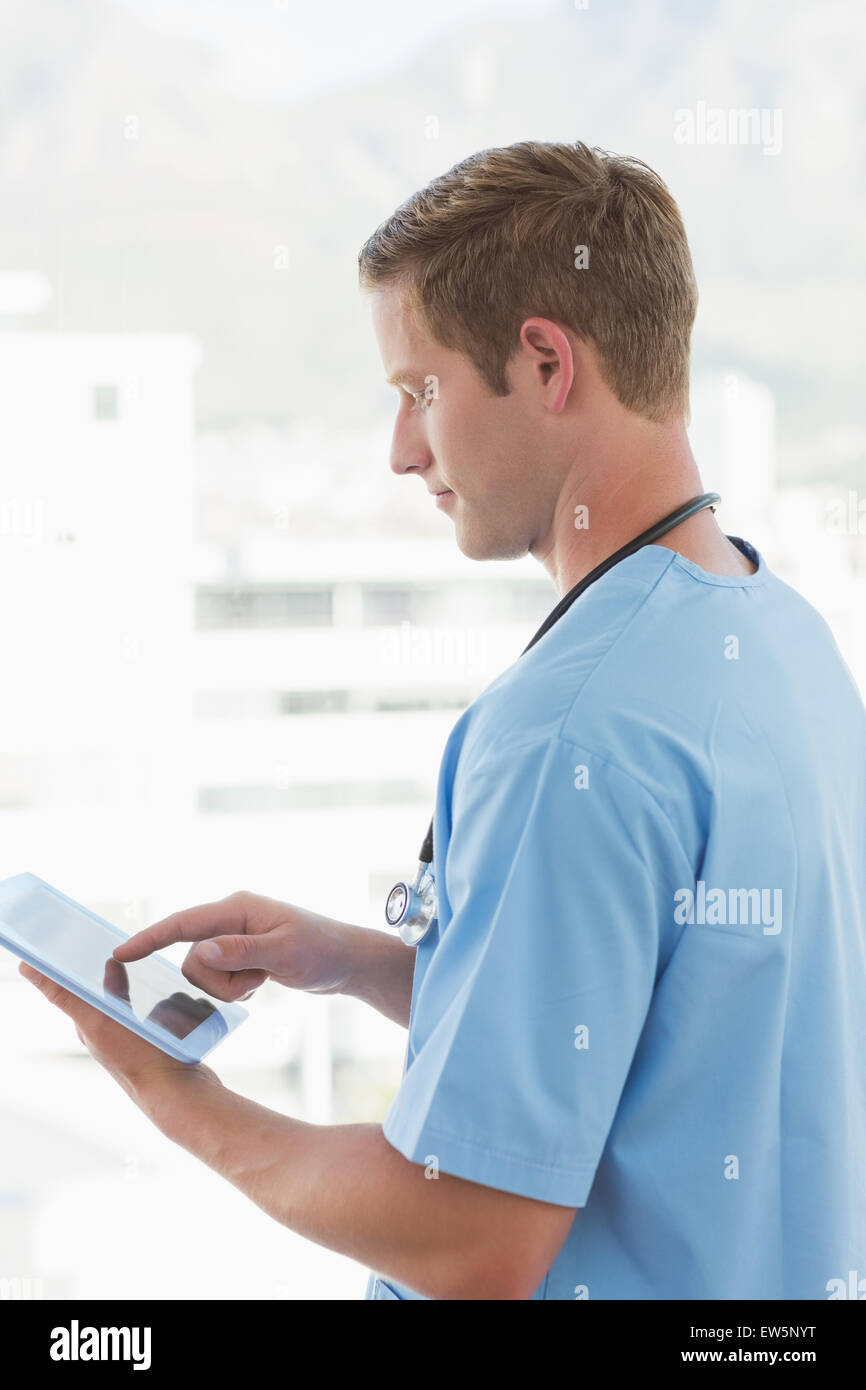 Doctor using tablet computer Stock Photo - Alamy